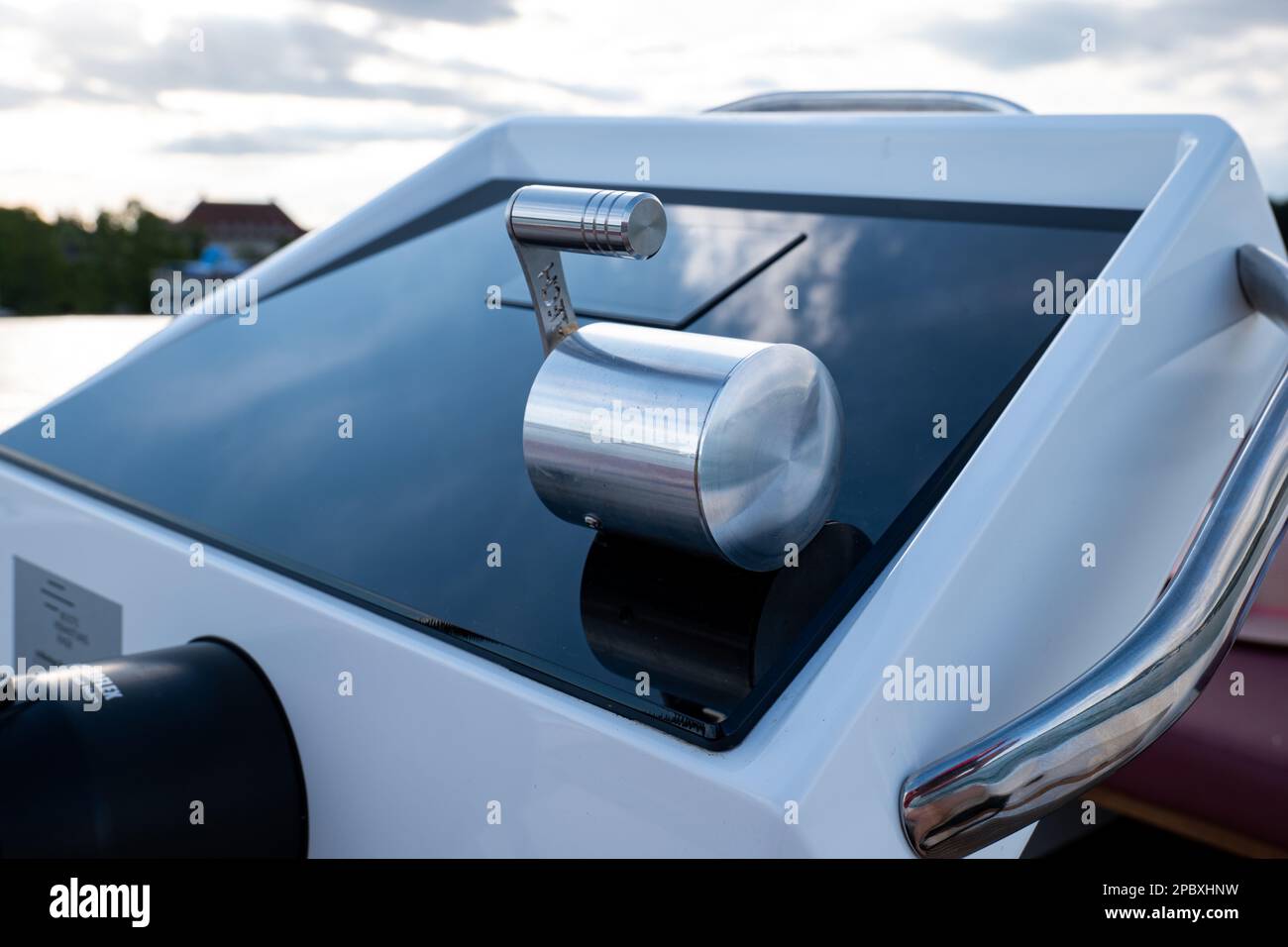 Chrome metal throttle lever of a small electric rental boat. Sunny ...