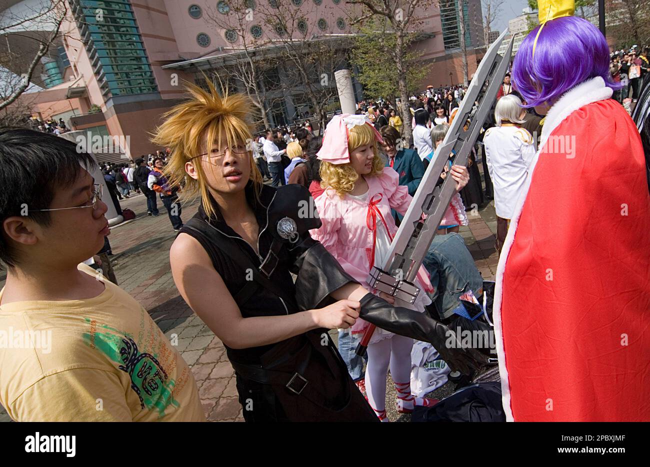 Young Taiwanese show off their accessories during a cosplay convention ...