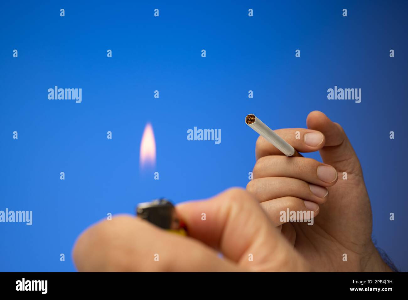 Hand holding lighter cigarette lighter hi-res stock photography and ...