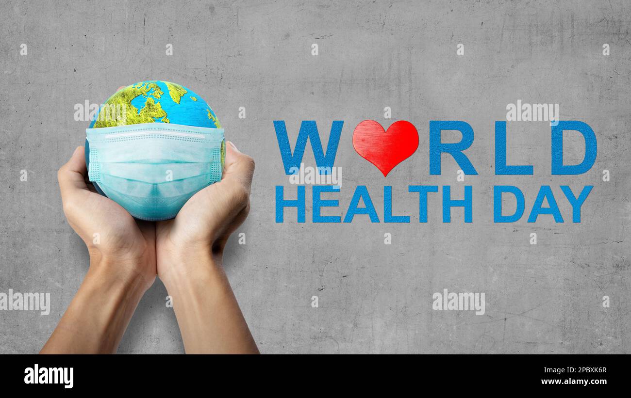Human hand showing earth with a face mask. World Health Day Concept ...