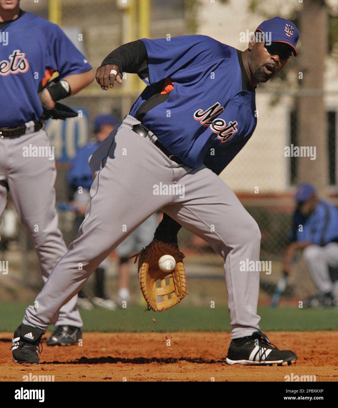 New York Mets first baseman Carlos Delgado catches a grounder between ...