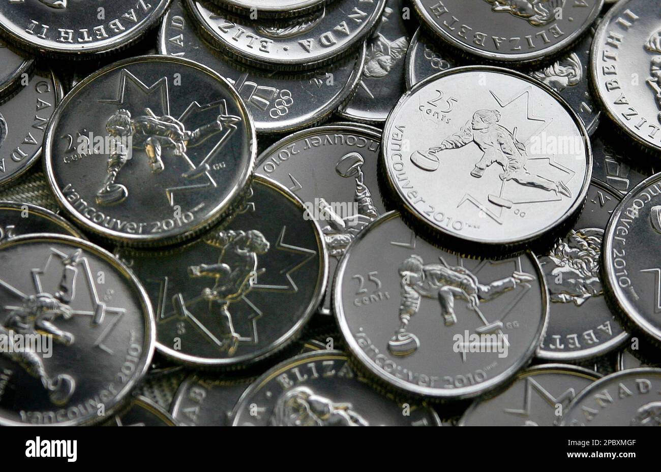 Samples of the newly released Olympic quarters at the Royal Canadian ...