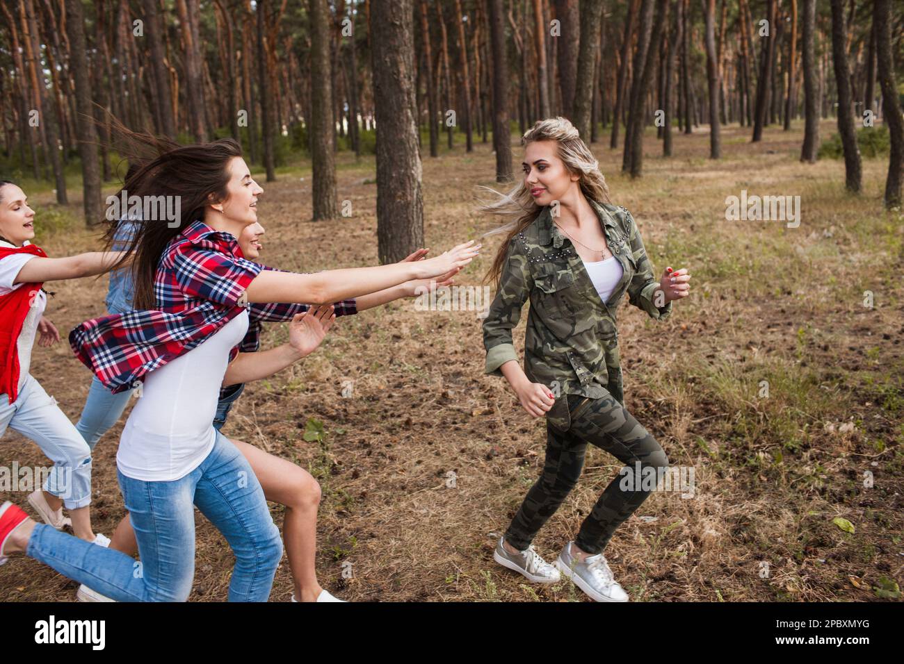 Friends women group running competition concept Stock Photo - Alamy