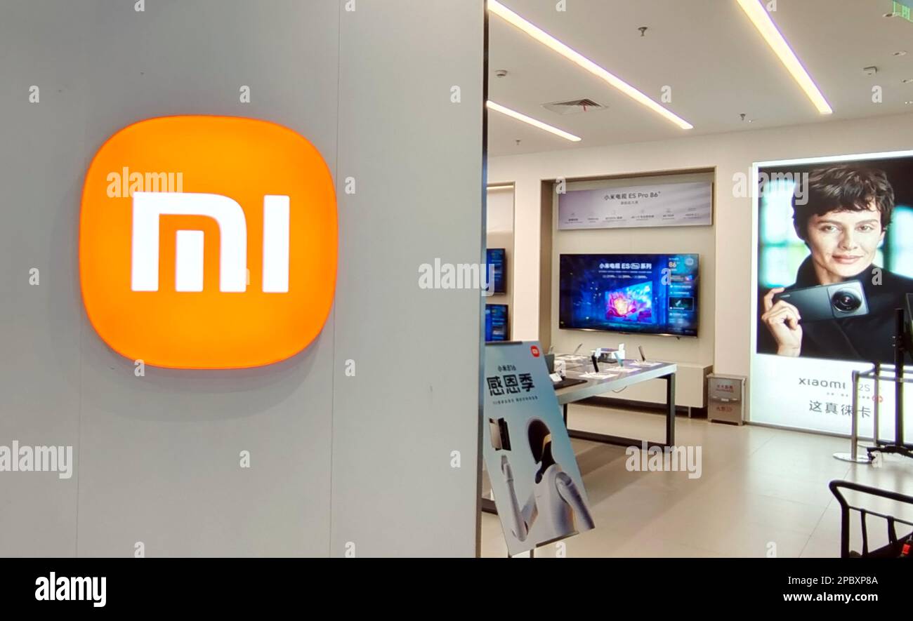 (FILE) Customers are seen at a MI 5G mobile phone store in Shanghai ...