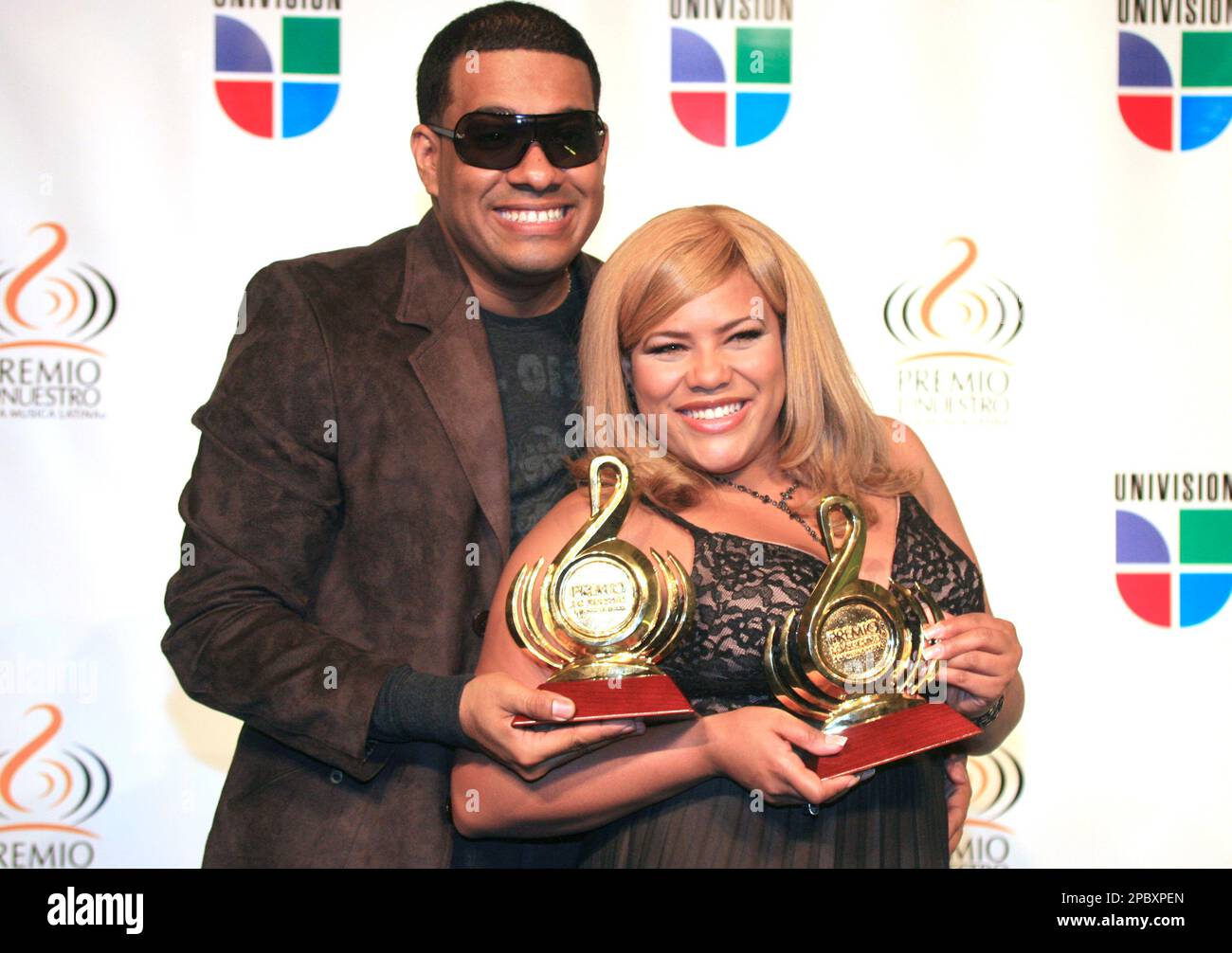 Monchy y Alexandra of the Dominican Republic hold up their award ...