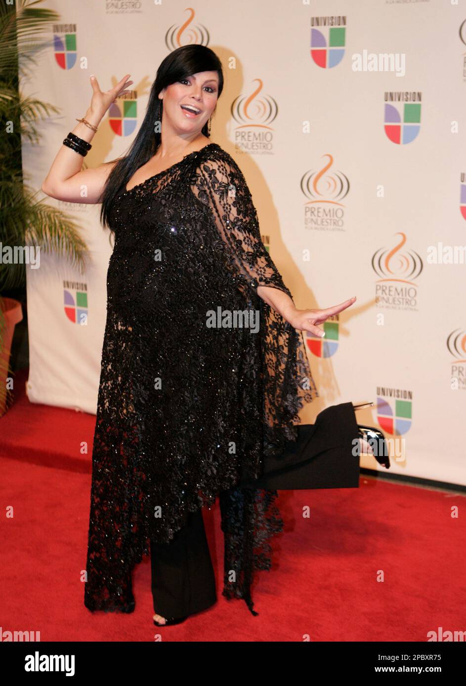 Puerto Rican singer Olga Tanon, who is pregnant, poses on the red ...