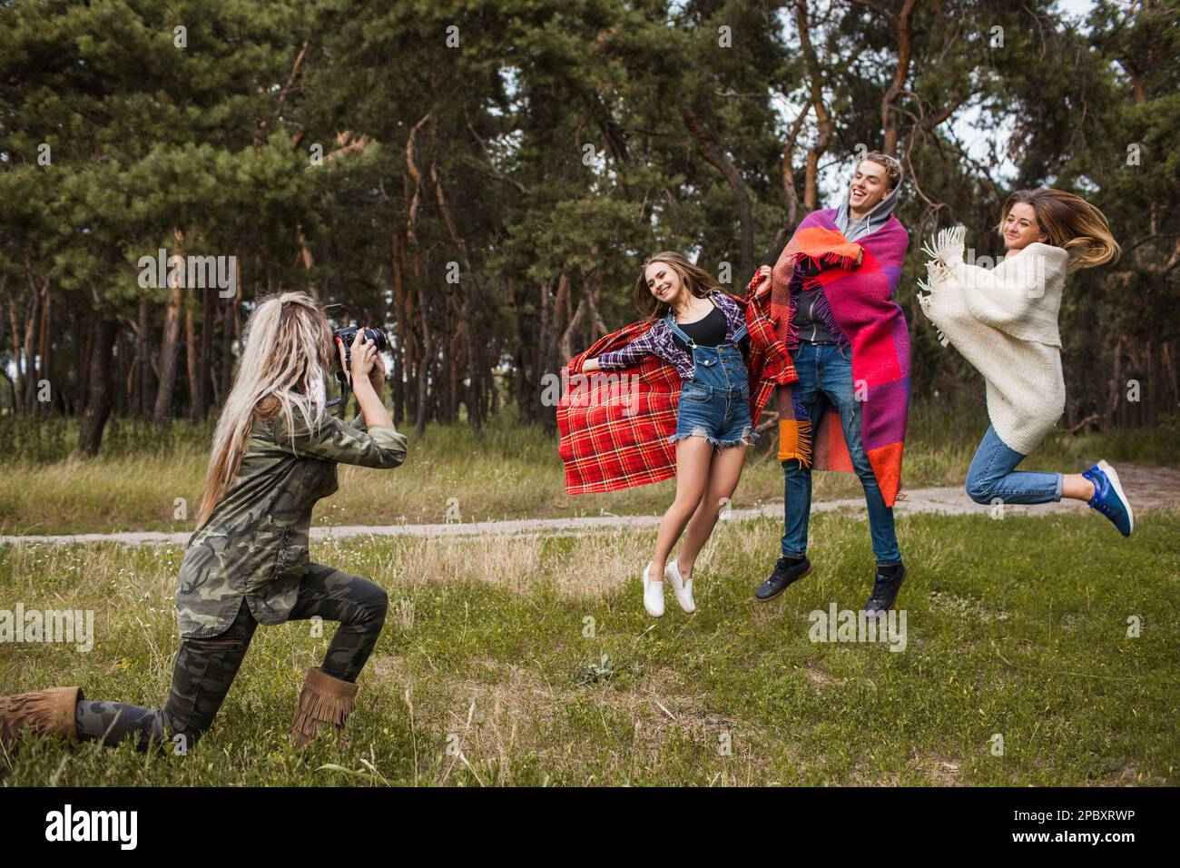 Friends fun jump nature photoshoot concept Stock Photo - Alamy