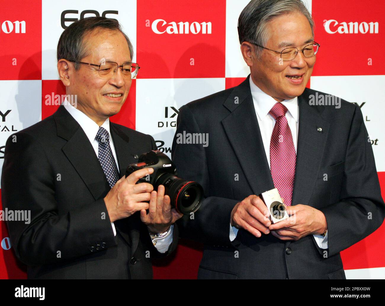 Canon Inc. COO and President Tsuneji Uchida, left, poses with the ...
