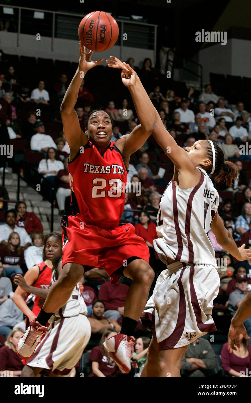 Texas Tech's LaVonda Henderson(23), left, shoots the ball while guarded ...