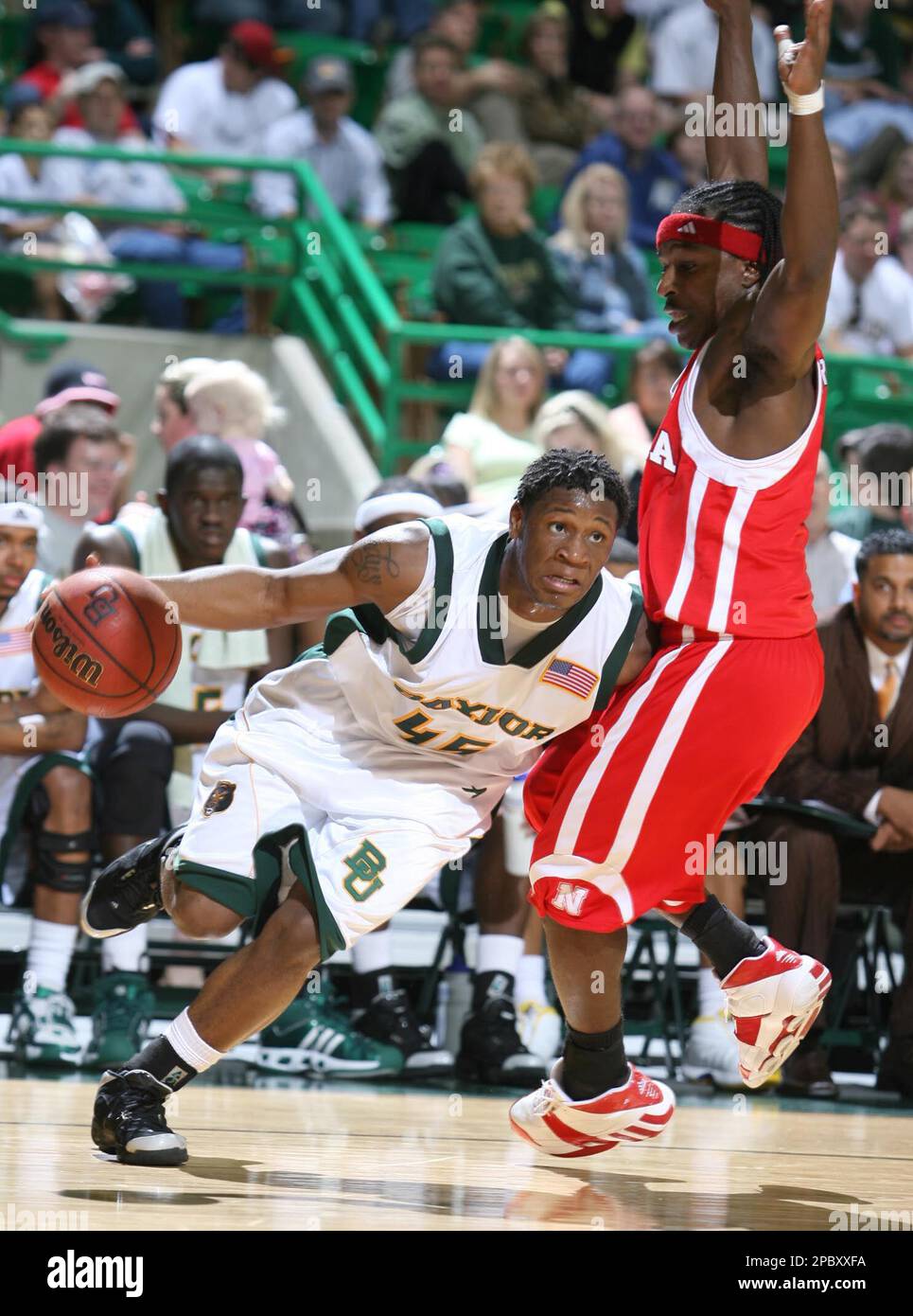 Baylor's Tweety Carter (45) drives around Nebraska's Jay-R Strowbridge ...