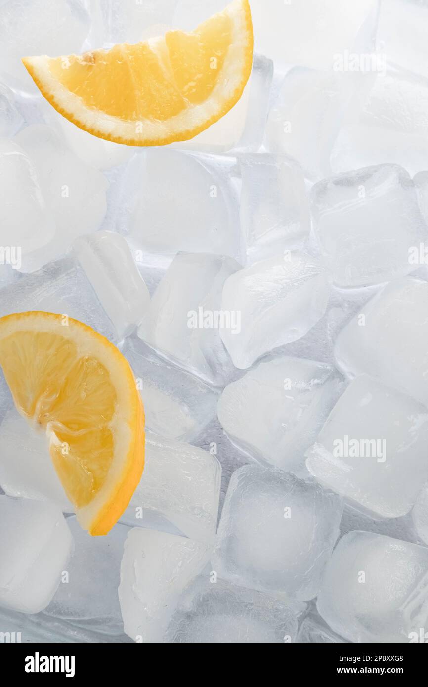 Ice cubes and lemon slices, refreshing food concept, food background ...