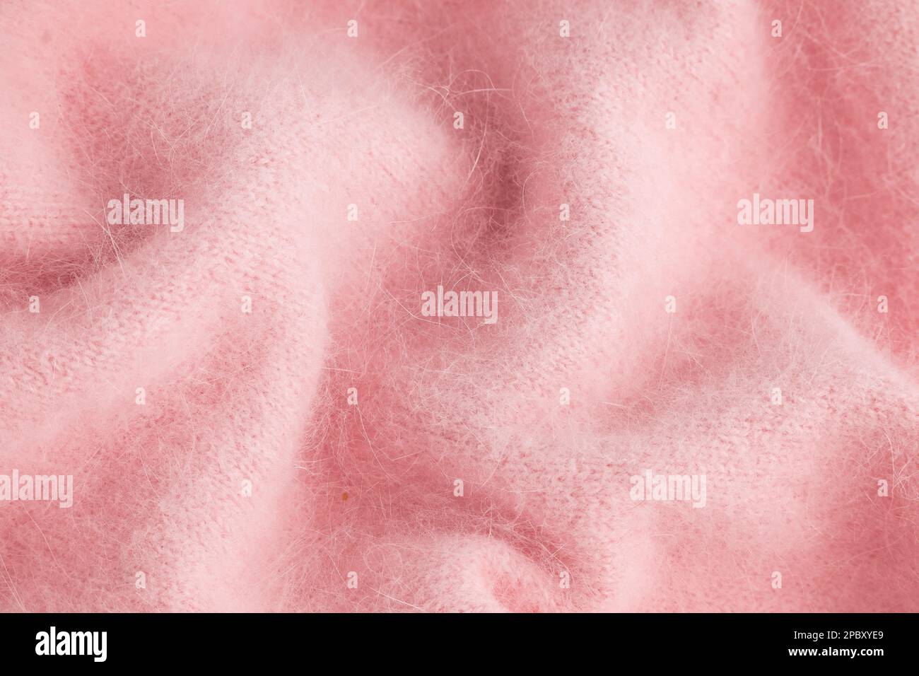 Close up of soft pink angora cloth, textile detail in pastel colors ...