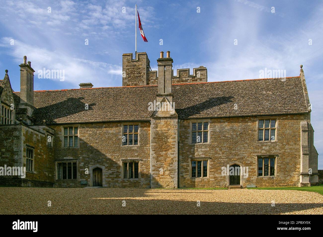 In the courtyard of Rockingham Castle, Northamptonshire, UK; a visitor ...