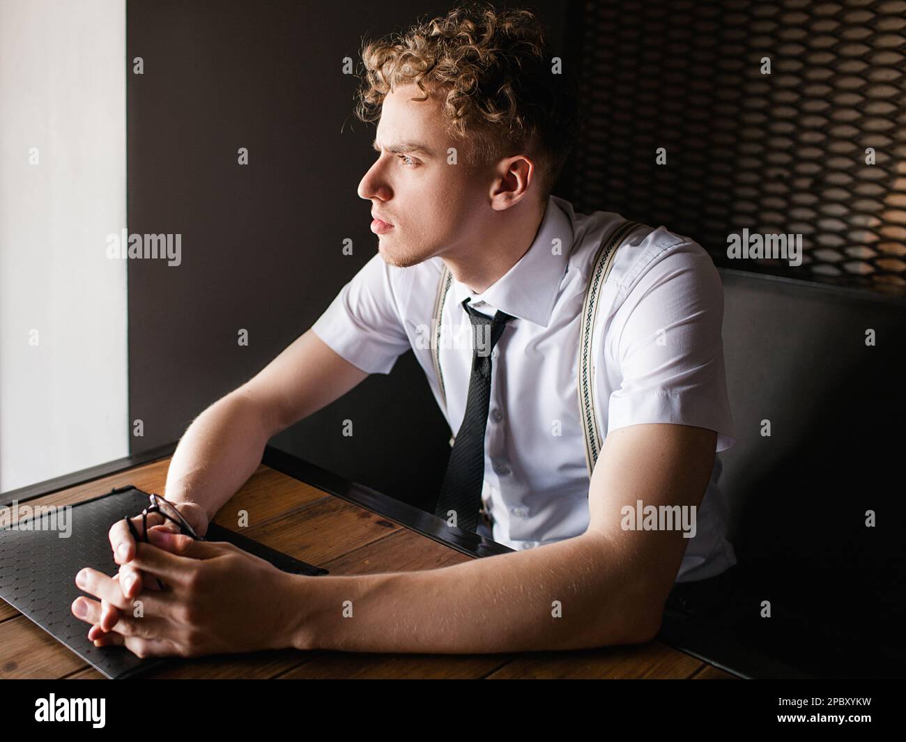 Serious businessman thinking waiting hi-res stock photography and ...