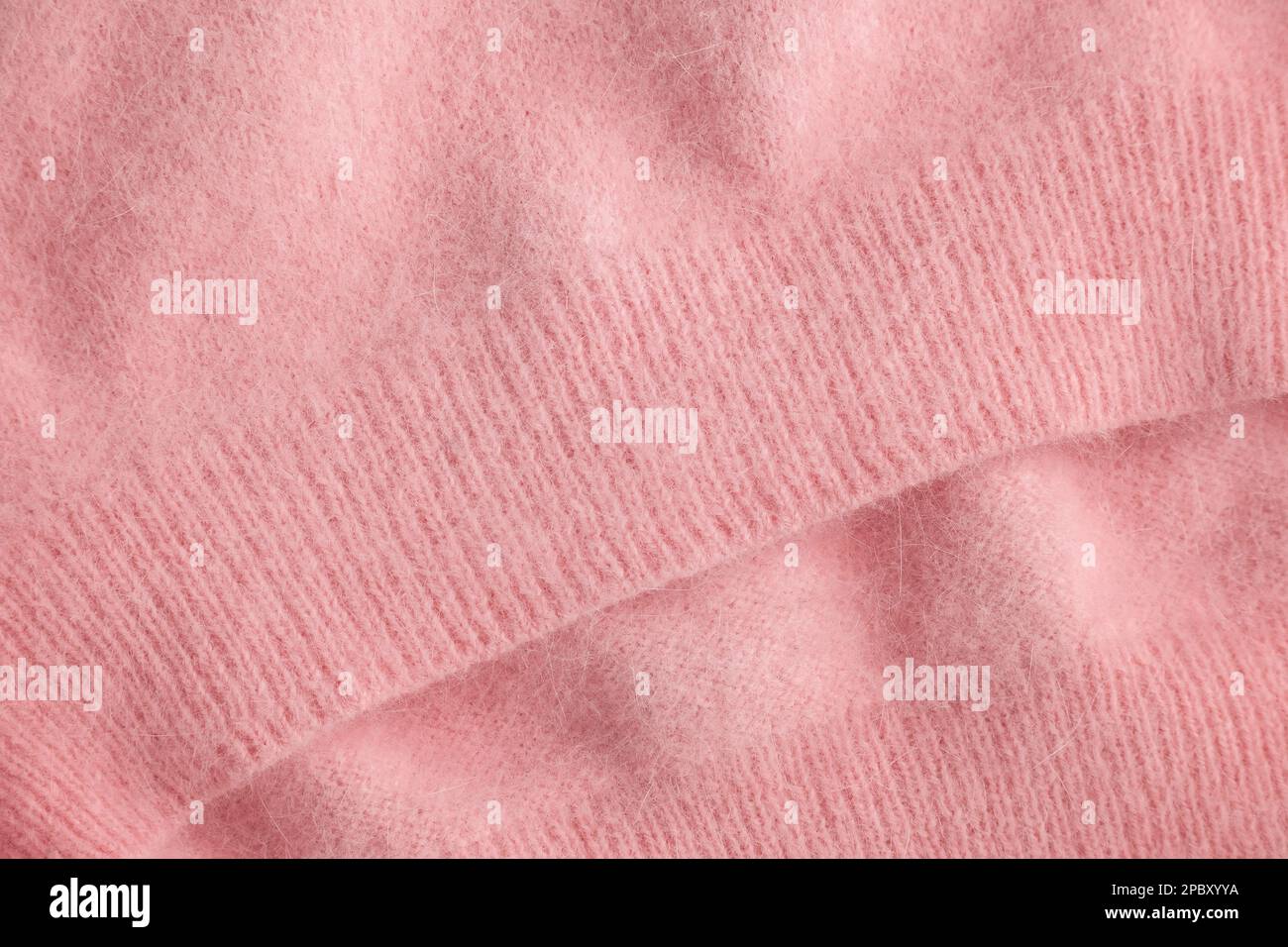 Close up of soft pink angora cloth, textile detail in pastel colors ...