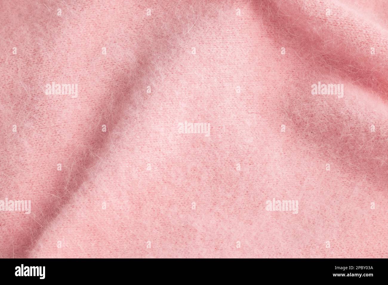 Close up of soft pink angora cloth, textile detail in pastel colors ...