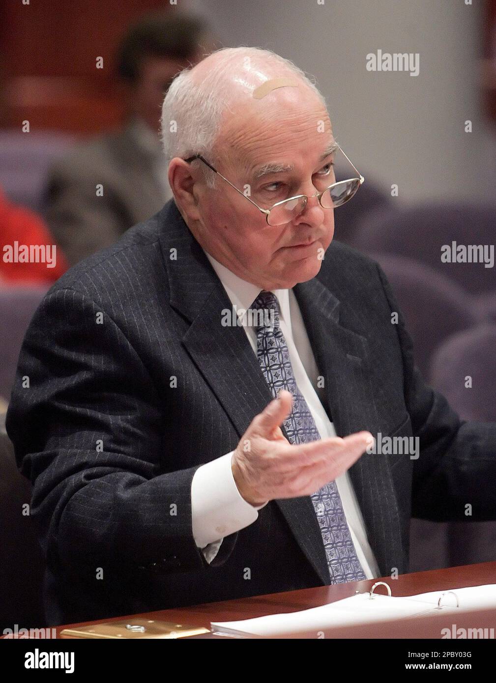 Former state Supreme Court Chief Justice William Sullivan answers a ...