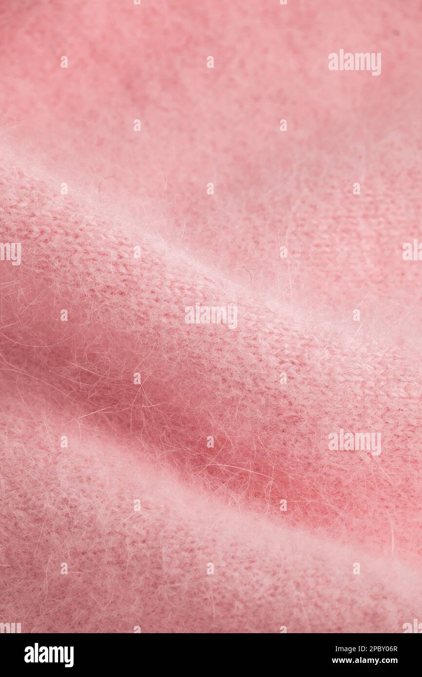 Close up of soft pink angora cloth, textile detail in pastel colors ...