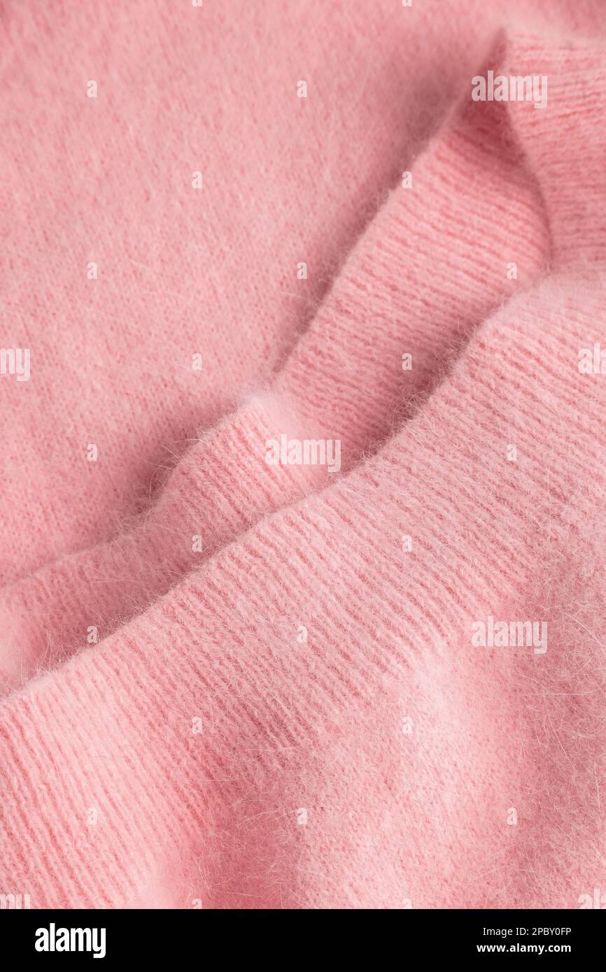 Close up of soft pink angora cloth, textile detail in pastel colors ...
