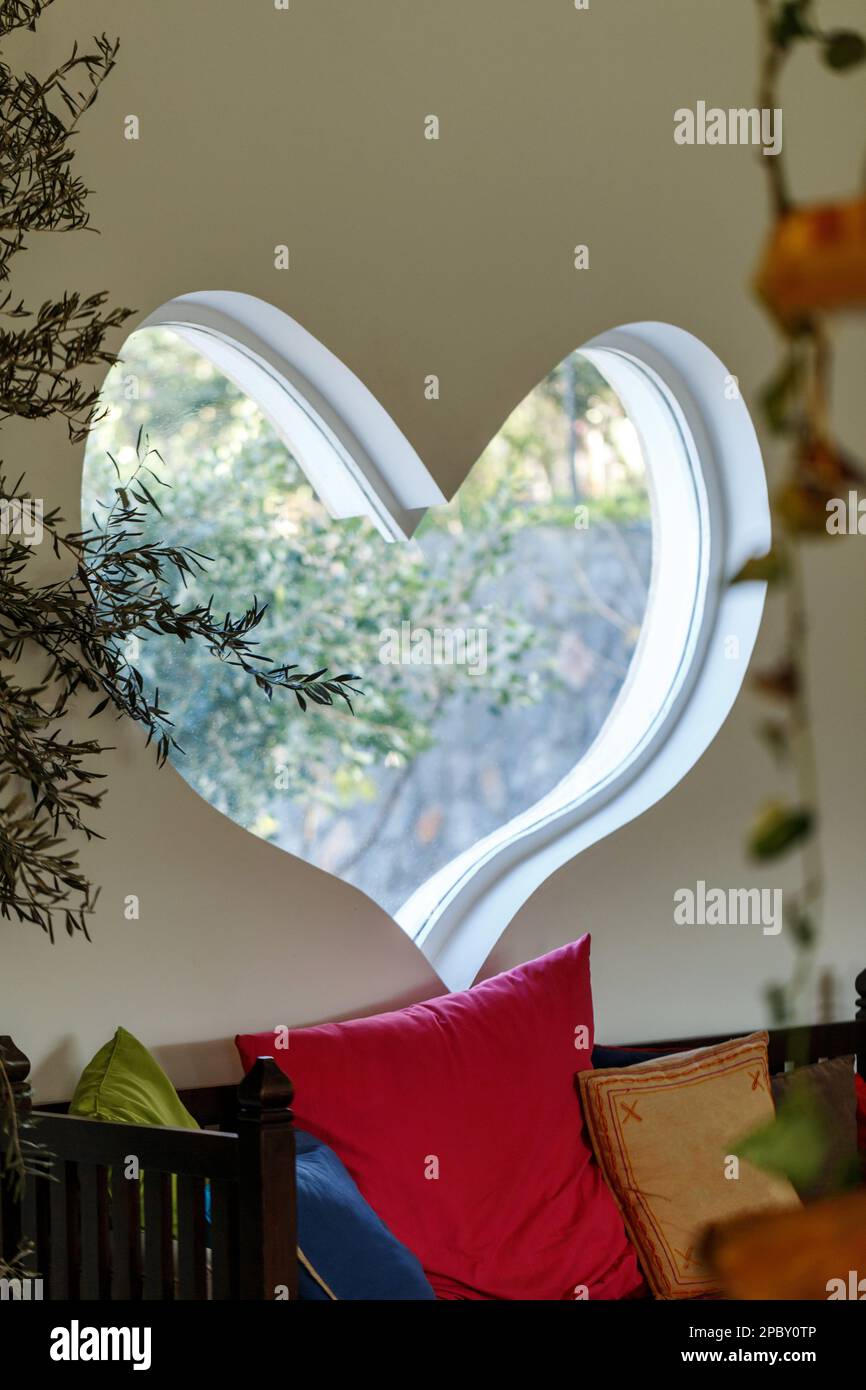 Scandinavian interior style with natural light from heart shaped window ...