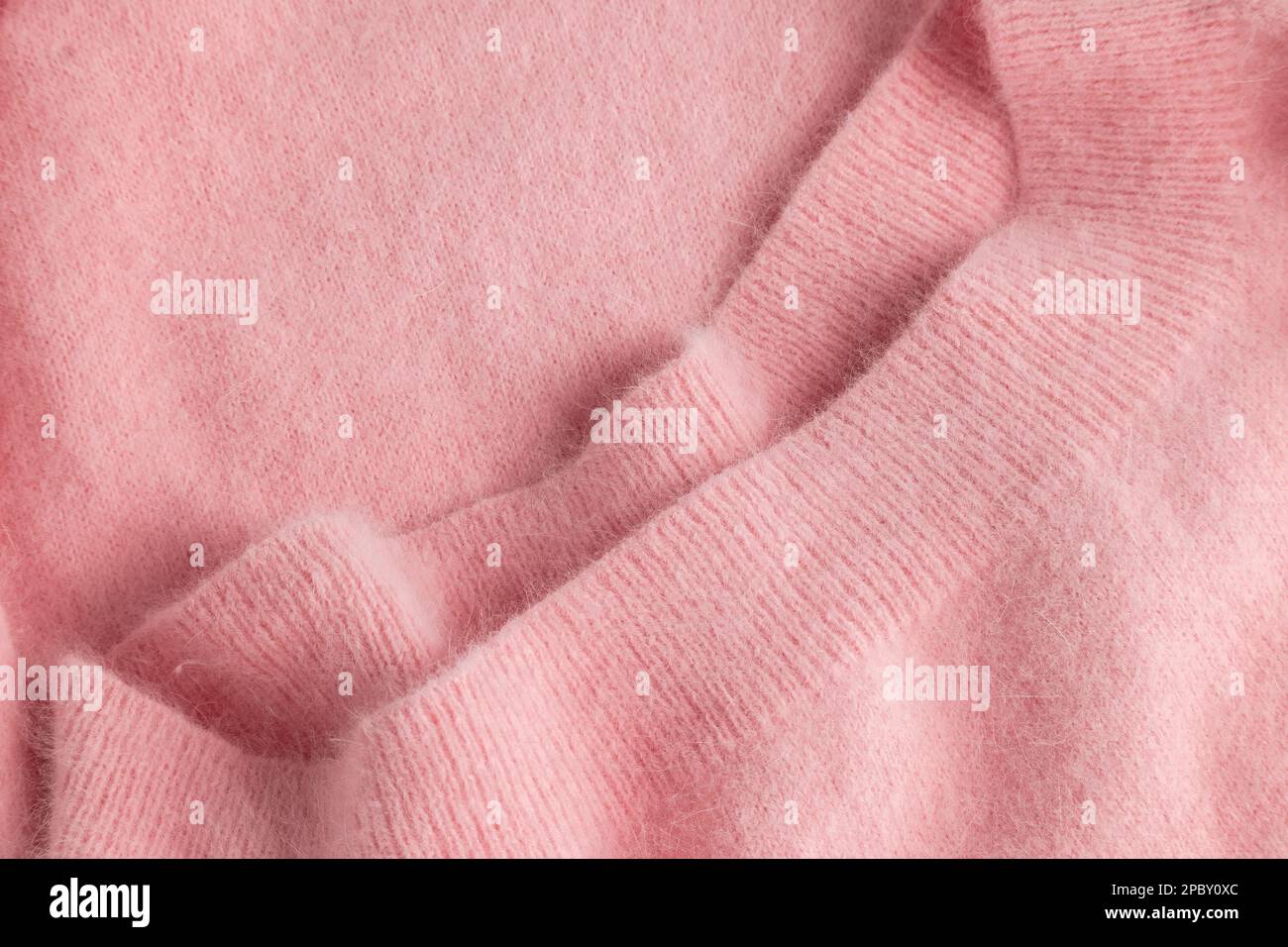 Close up of soft pink angora cloth, textile detail in pastel colors ...