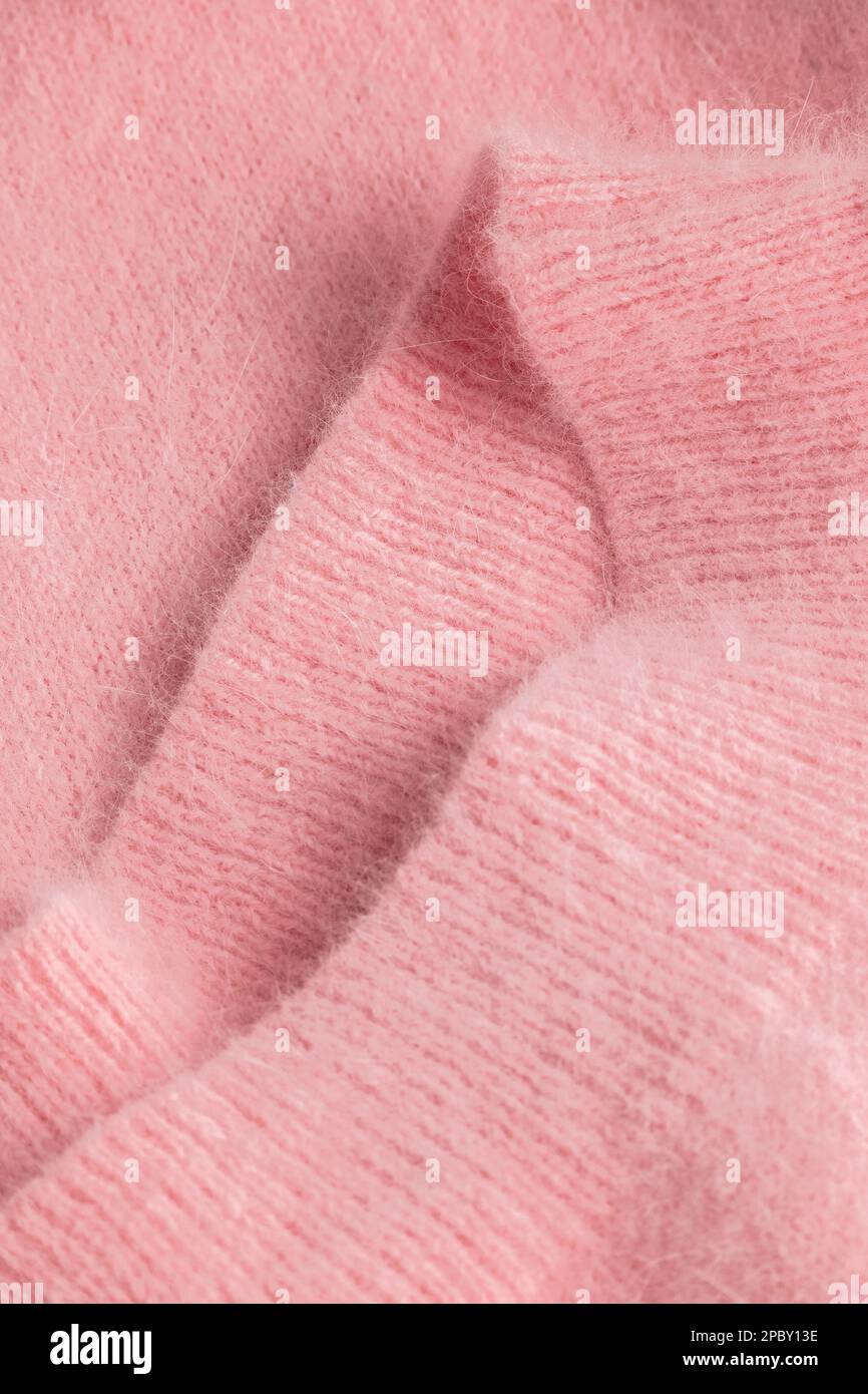 Close up of soft pink angora cloth, textile detail in pastel colors ...