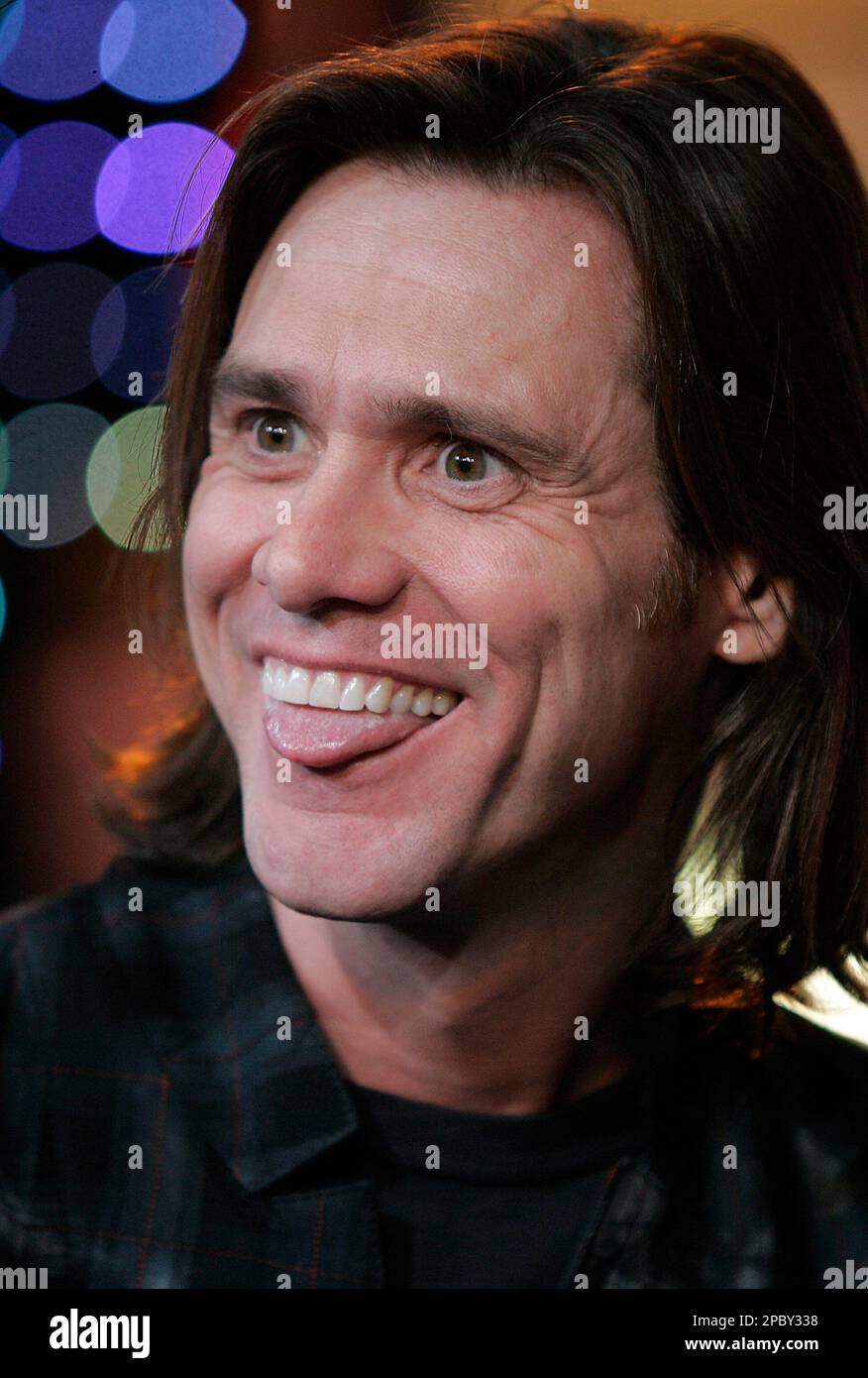 Actor Jim Carrey makes a face as he appears on stage during MTV's ...
