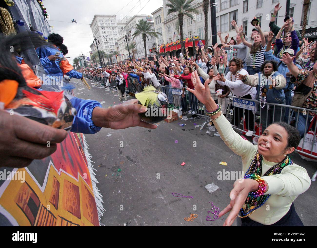 A woman hops the police barricade to get one of the famed Zulu coconuts ...