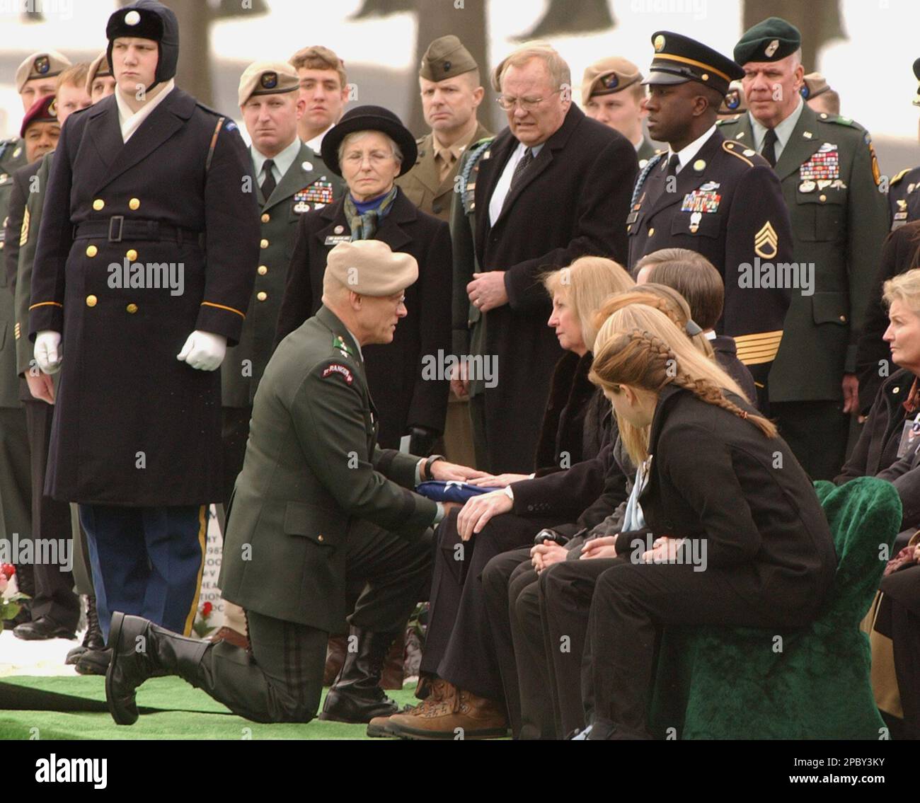 Army Lt. Gen. Robert Wagner, left, present an American Flag to Mary ...