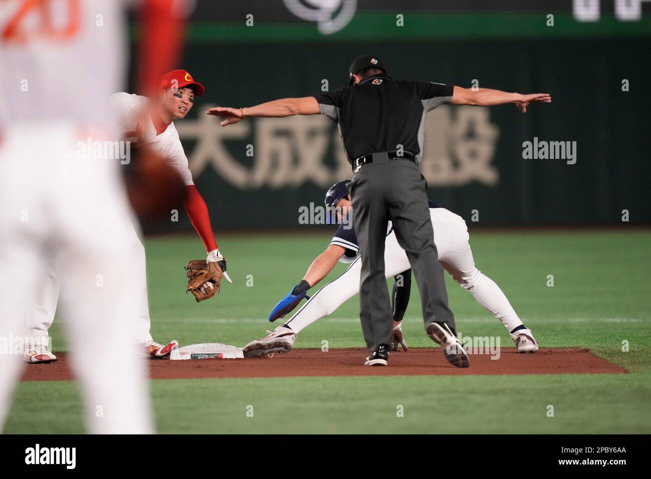 Second base umpire Chang Chan-hung makes the call as South Korea's Lee ...