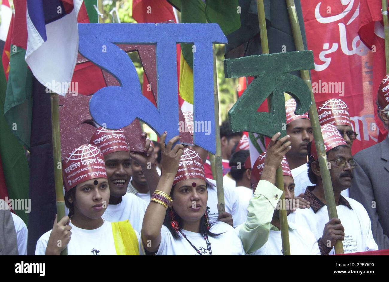 Bangladeshi cultural workers hold Bangla alphabets "MA," and "KA" as ...