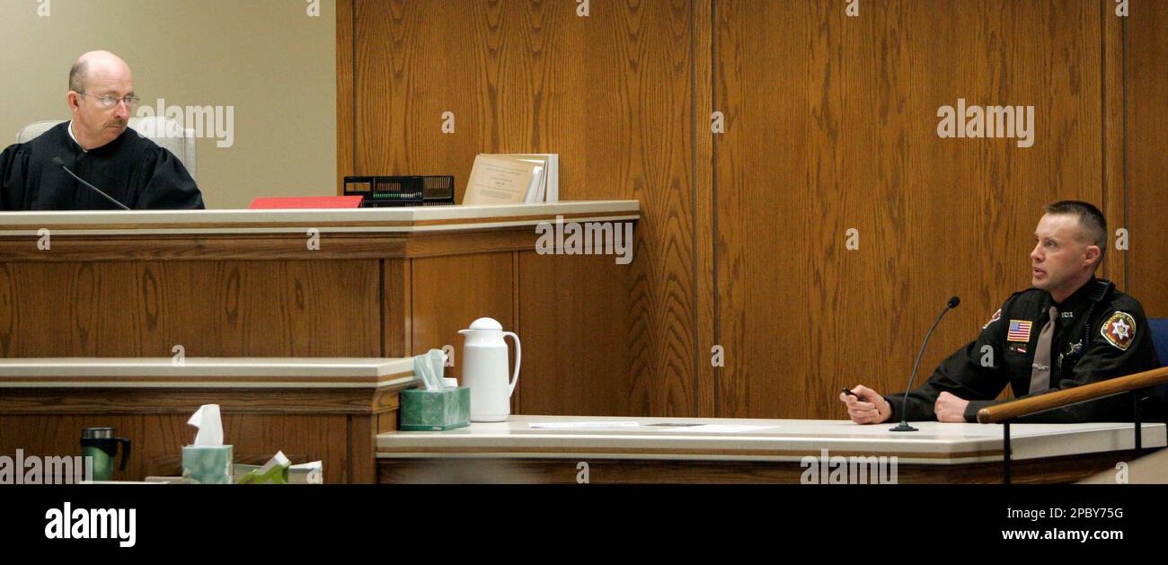 Manitowoc County Circuit Judge Patrick Willis, left, listens to ...