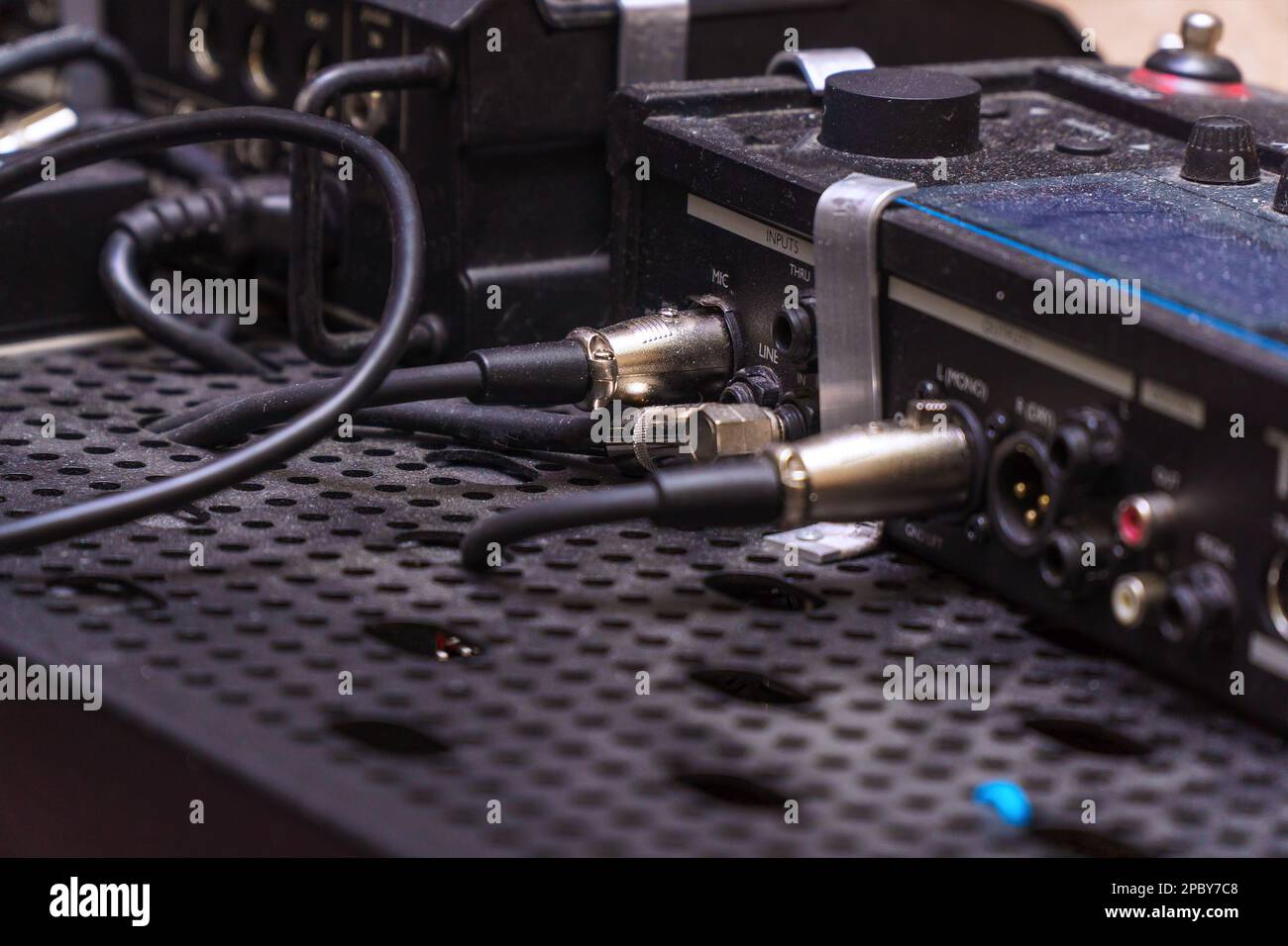 Audio jacks are plugged into a guitar synthesizer or processor Stock ...