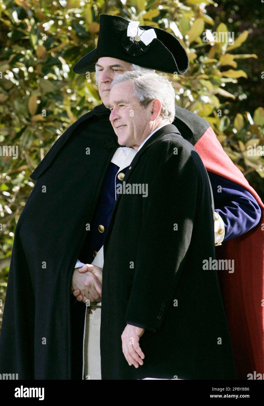 President Bush, right, shakes hands with Dean Malissa as Gen. George ...