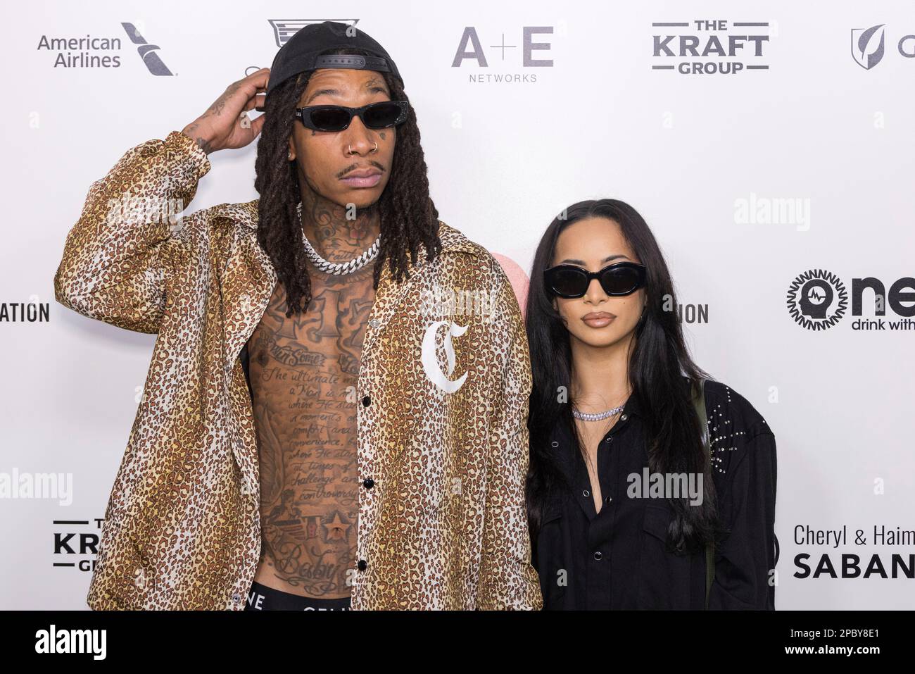 Wiz Khalifa, left and Aimee Aguilar arrive at the Elton John AIDS Foundation's 31st Annual ...