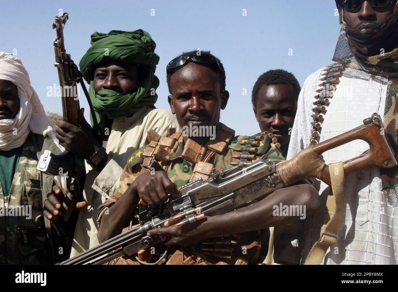 A section leader from the Sudan Liberation Army, center, wearing a ...