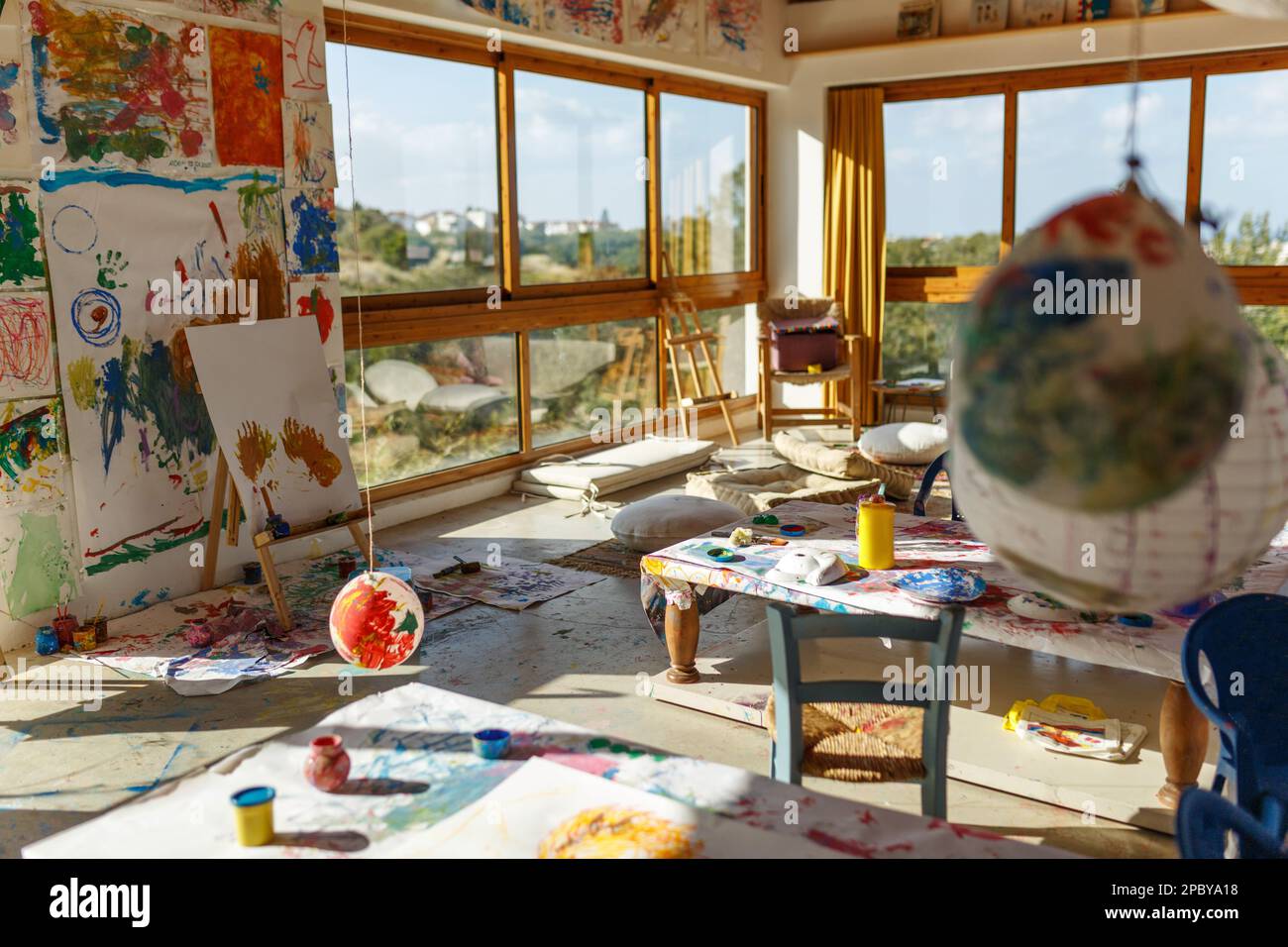 Daylight Art Studio Interior with Large Windows, Multiple Stretched ...