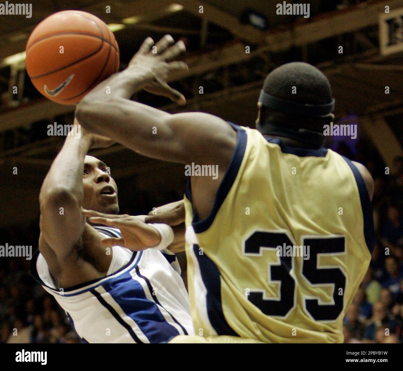 Duke's DeMarcus Nelson, left, tries to shoot past Georgia Tech's Zach ...
