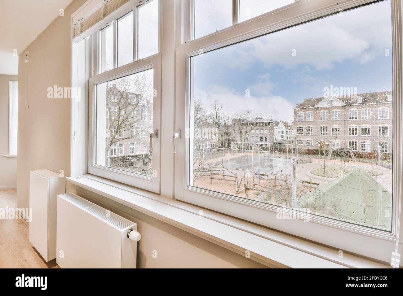 Interior of contemporary light room with windows overlooking ...