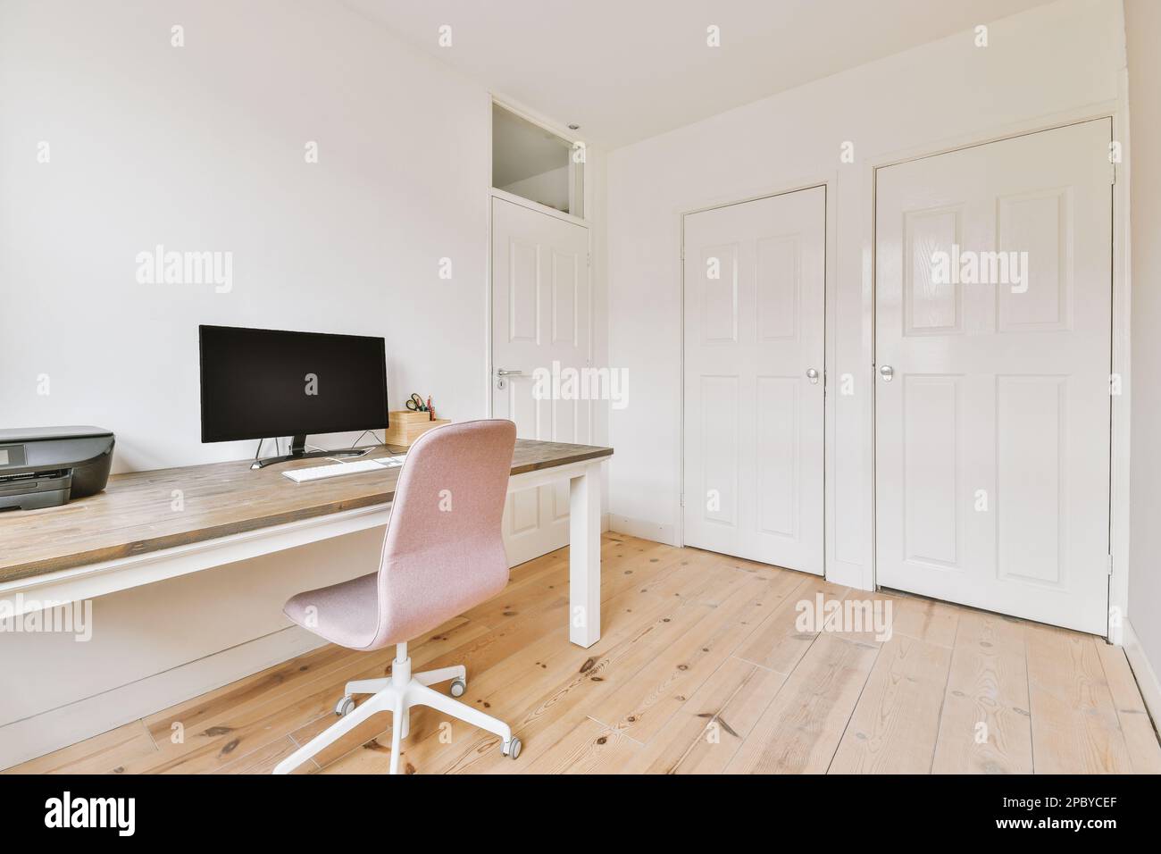 Interior design of study room with wooden table and desktop computer ...
