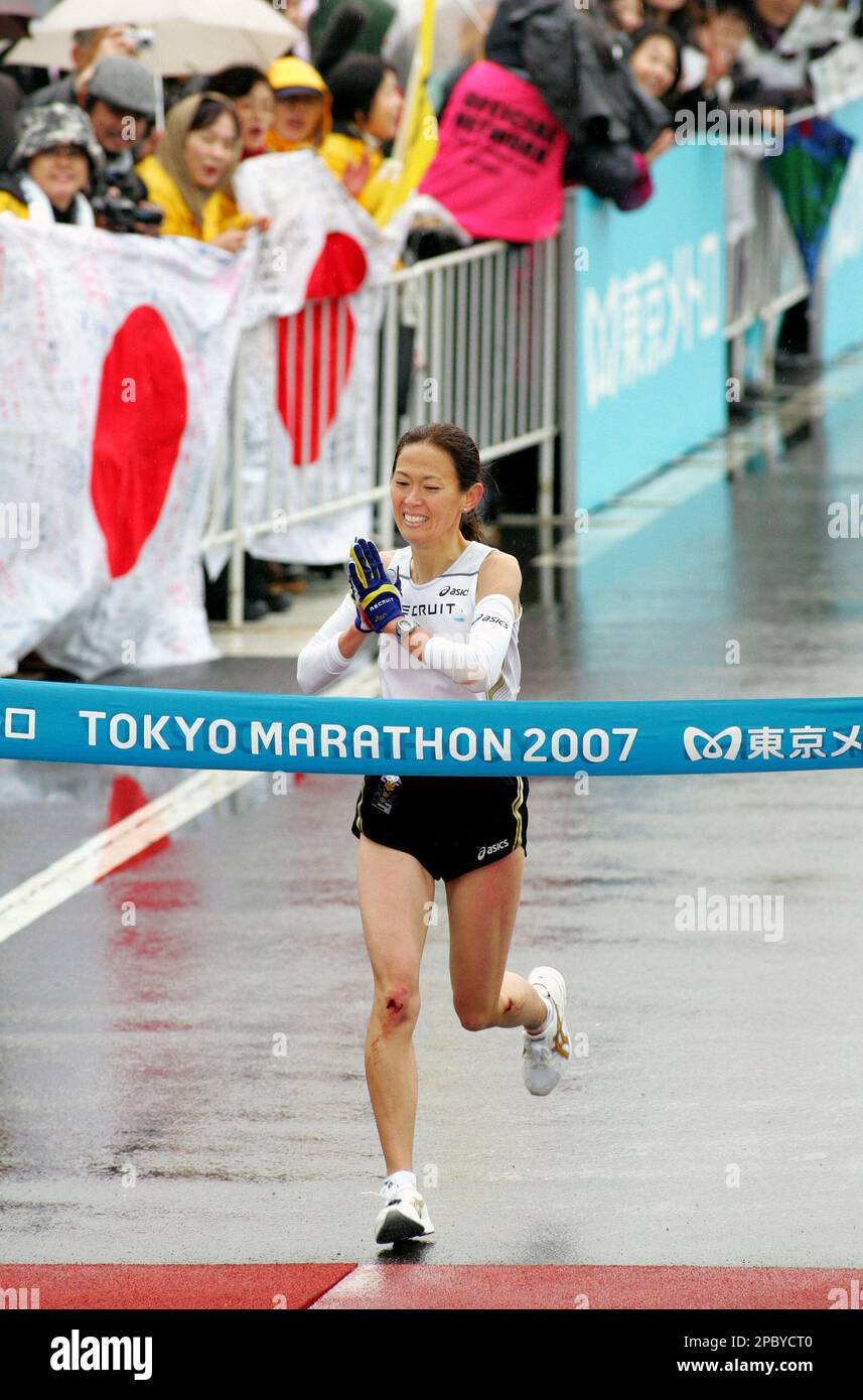 Japanese two-time Olympic medalist Yuko Arimori crosses the finish line ...