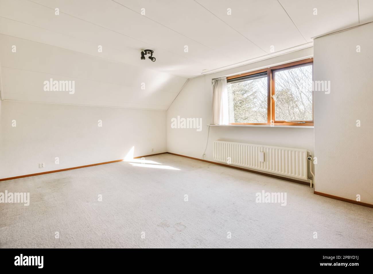 Interior design of light bedroom with wooden window with curtains near ...