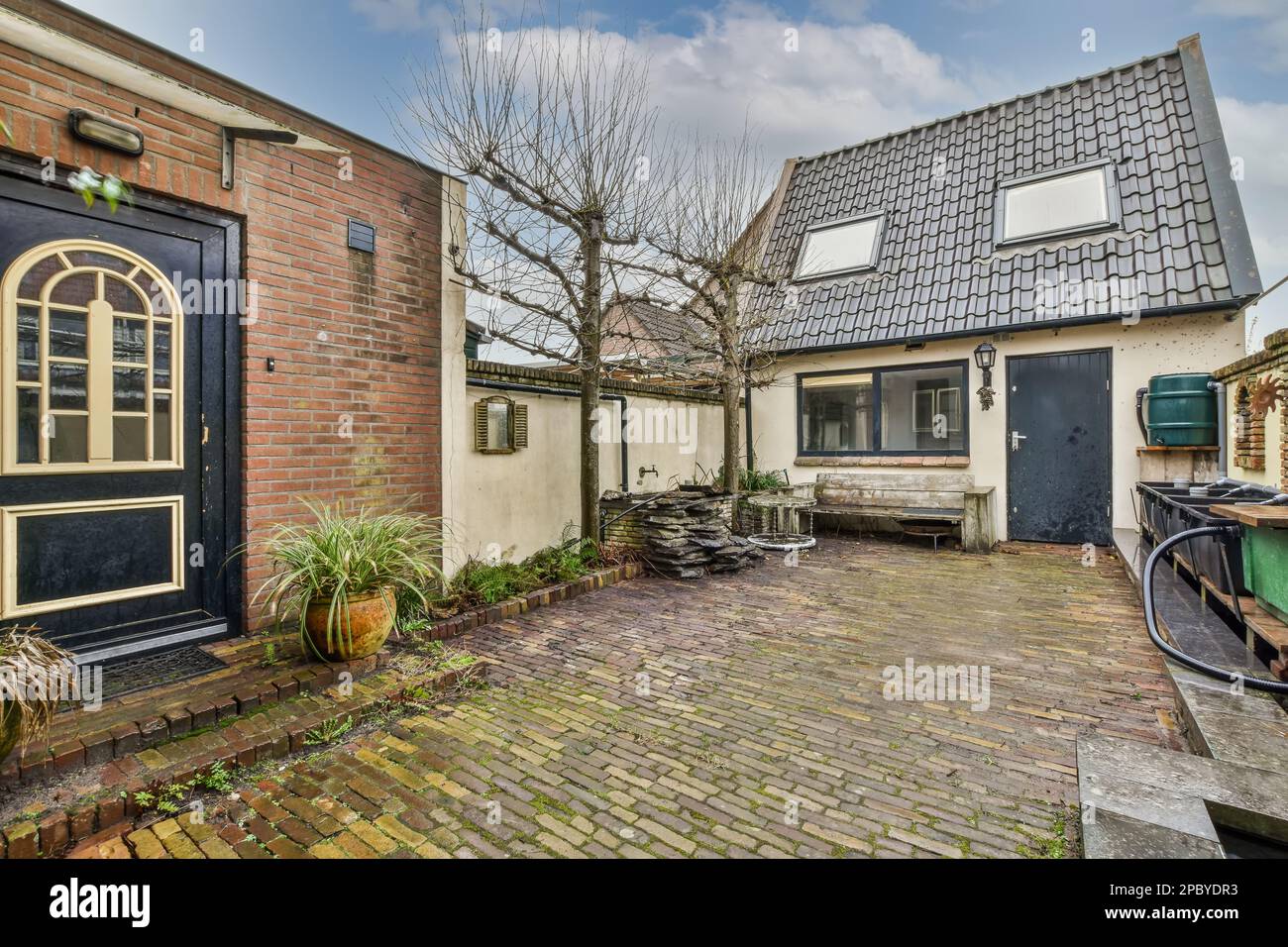 Exterior of brick residential building with windows and door located on ...