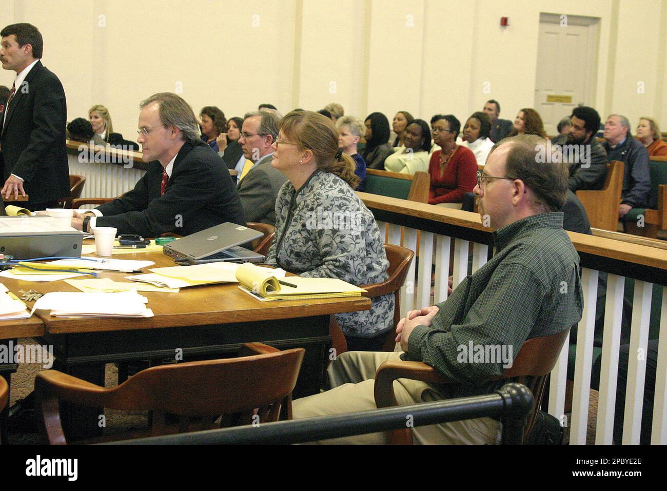 Steven Bixby, right, listens to testimony with members of his defense ...