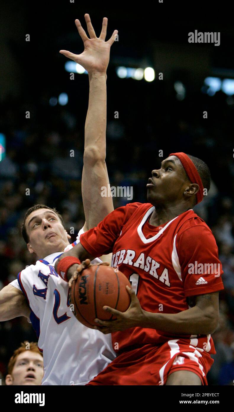 Kansas center Sasha Kaun, left, pressures Nebraska guard Sek Henry as ...