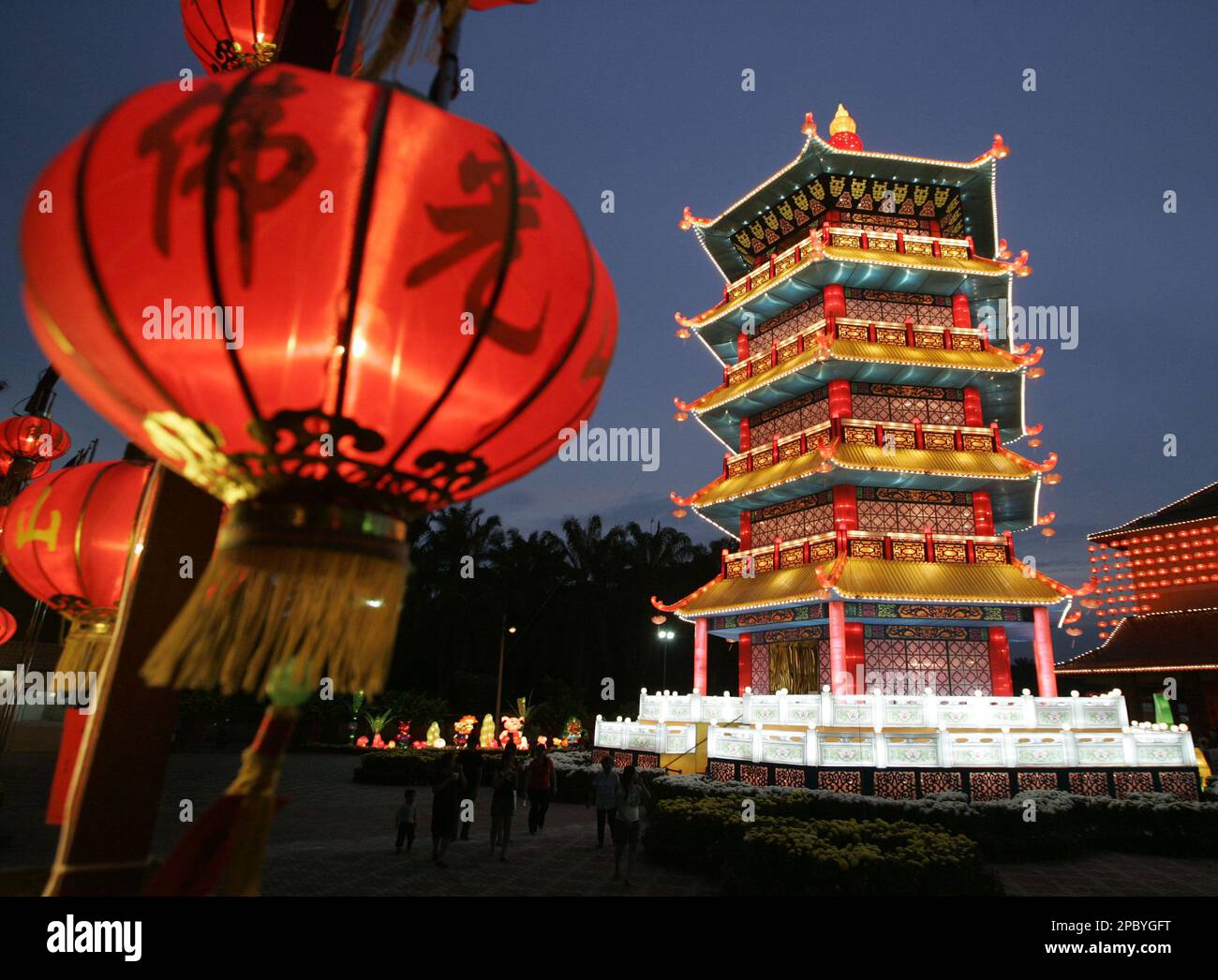 Visitors walk past the Lotus Pagoda at Fo Guang Shan temple in Jenjarom ...