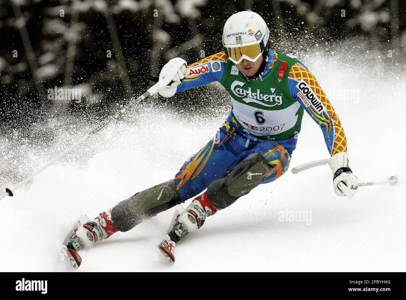 Sweden's Markus Larsson, speeds past a pole during the first run of the ...
