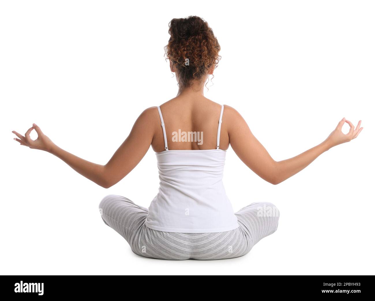 African-American woman meditating on white background, back view Stock ...