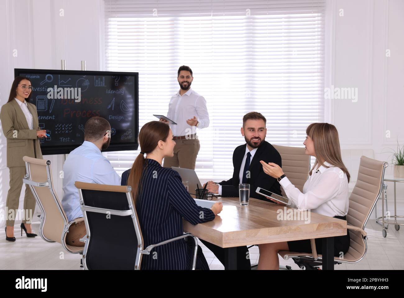 Business training. People in meeting room with interactive board Stock ...
