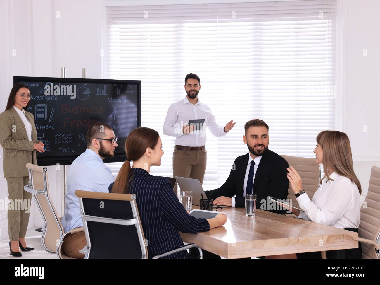 Business training. People in meeting room with interactive board Stock ...